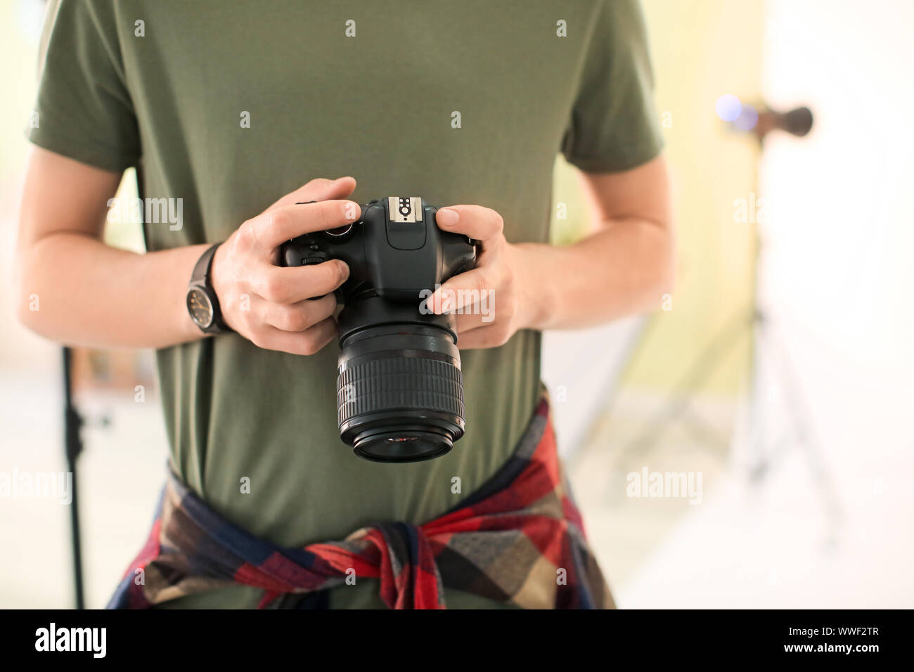 Teenage photographer in professional studio, closeup Stock Photo - Alamy