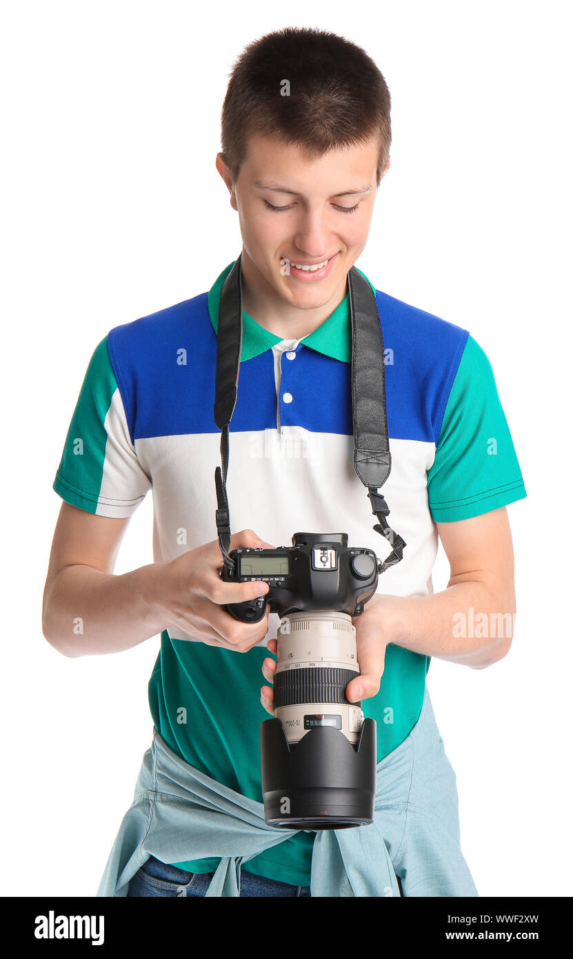 Teenage boy with photo camera on white background Stock Photo - Alamy