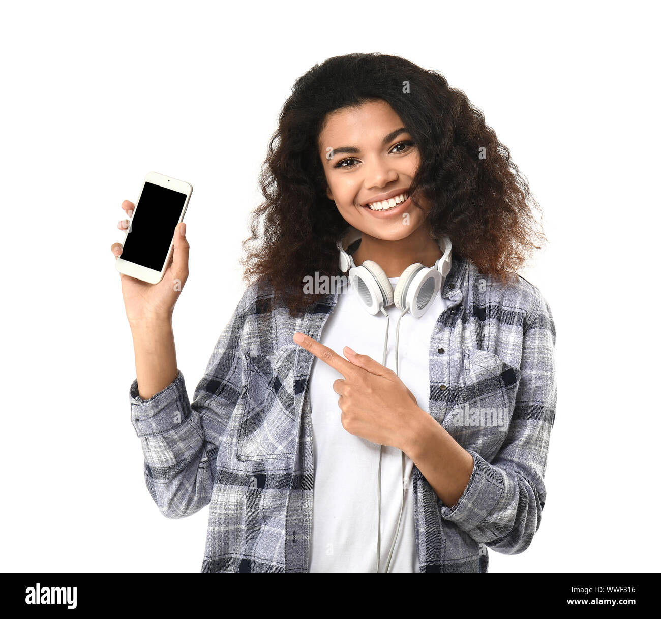 Portrait of cute African-American woman with mobile phone on white ...