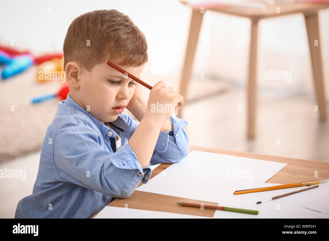 Cute little boy drawing at home Stock Photo - Alamy