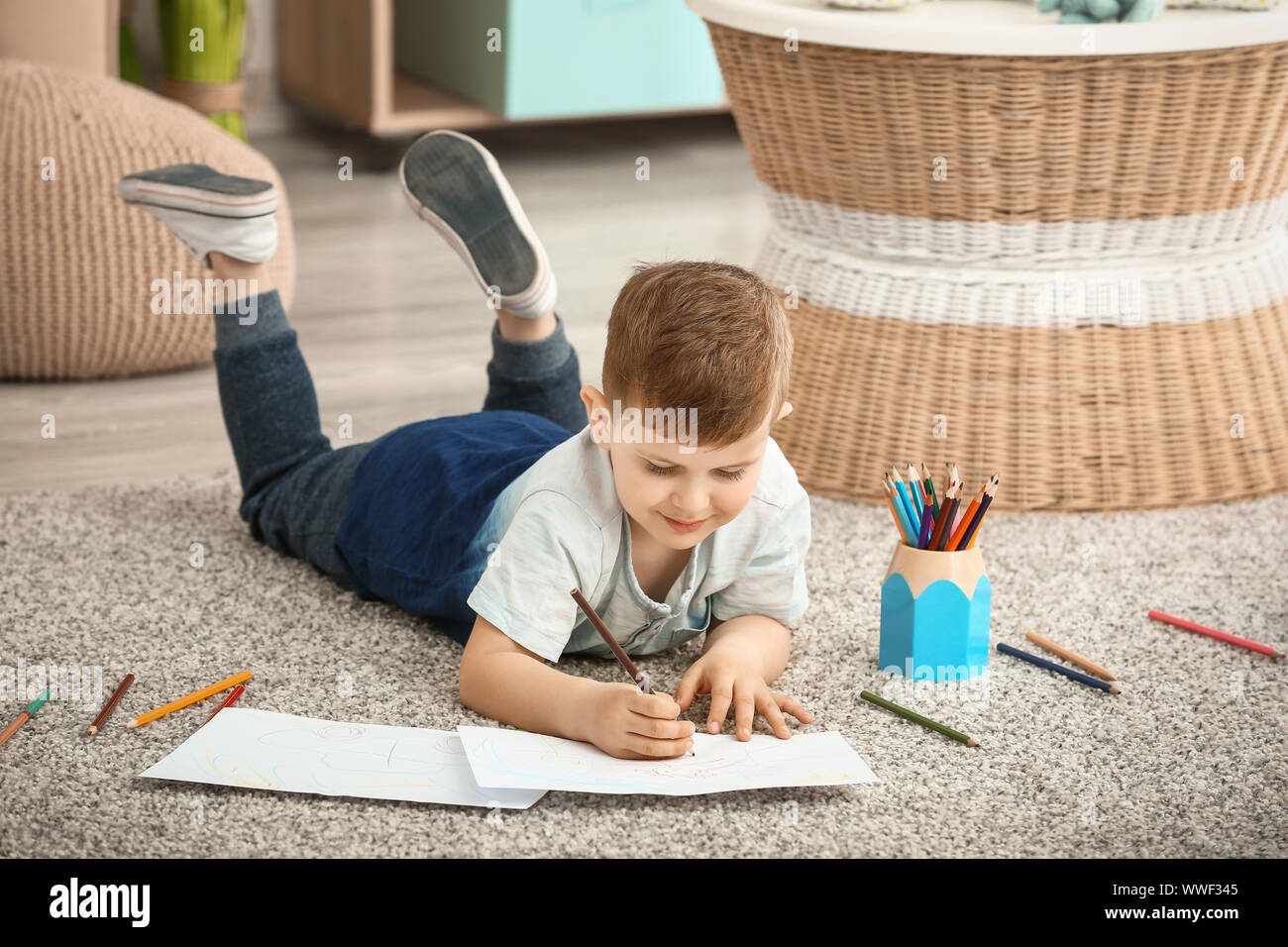 Cute little boy drawing at home Stock Photo - Alamy