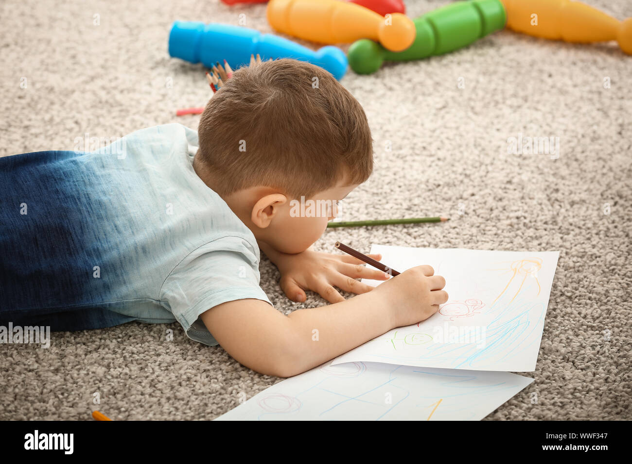 Cute little boy drawing at home Stock Photo - Alamy