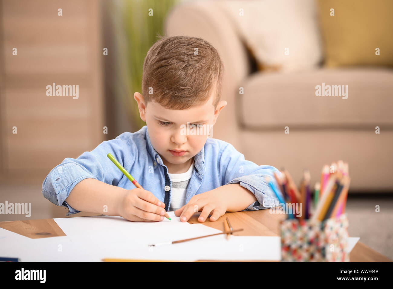 Cute little boy drawing at home Stock Photo - Alamy