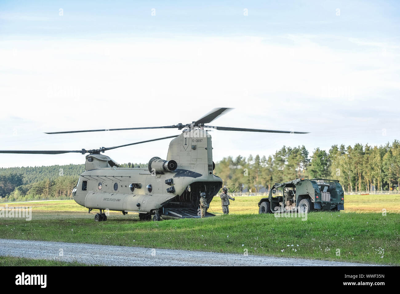 A U.S. Army paratrooper assigned to the 173rd Airborne Brigade guides ...