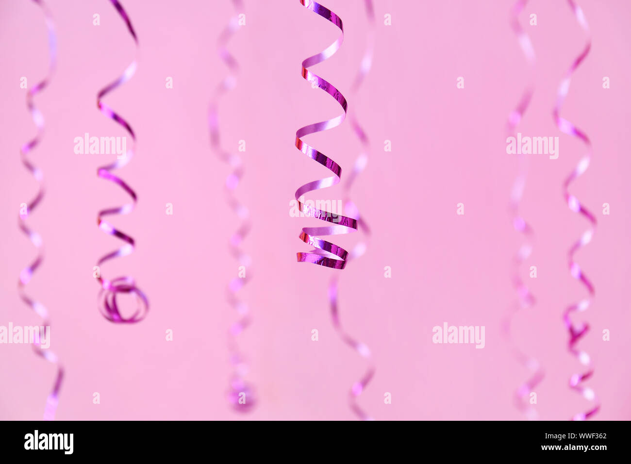 Streamers on color background Stock Photo - Alamy