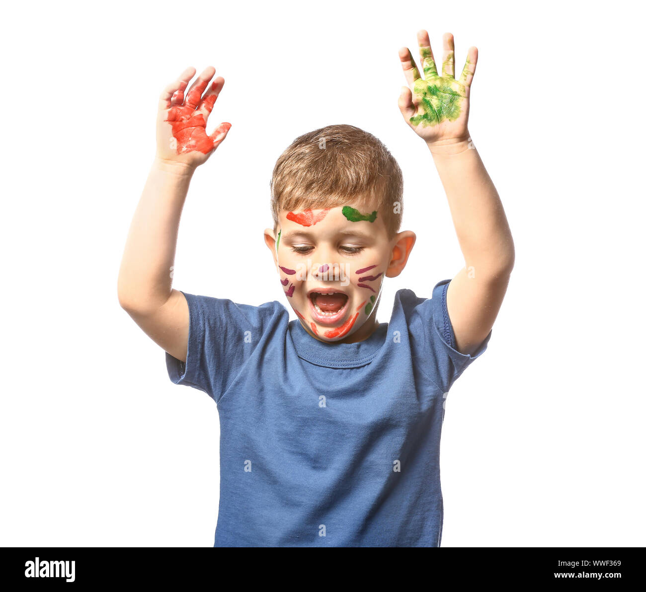 Funny little boy with hands and face in paint on white background Stock ...