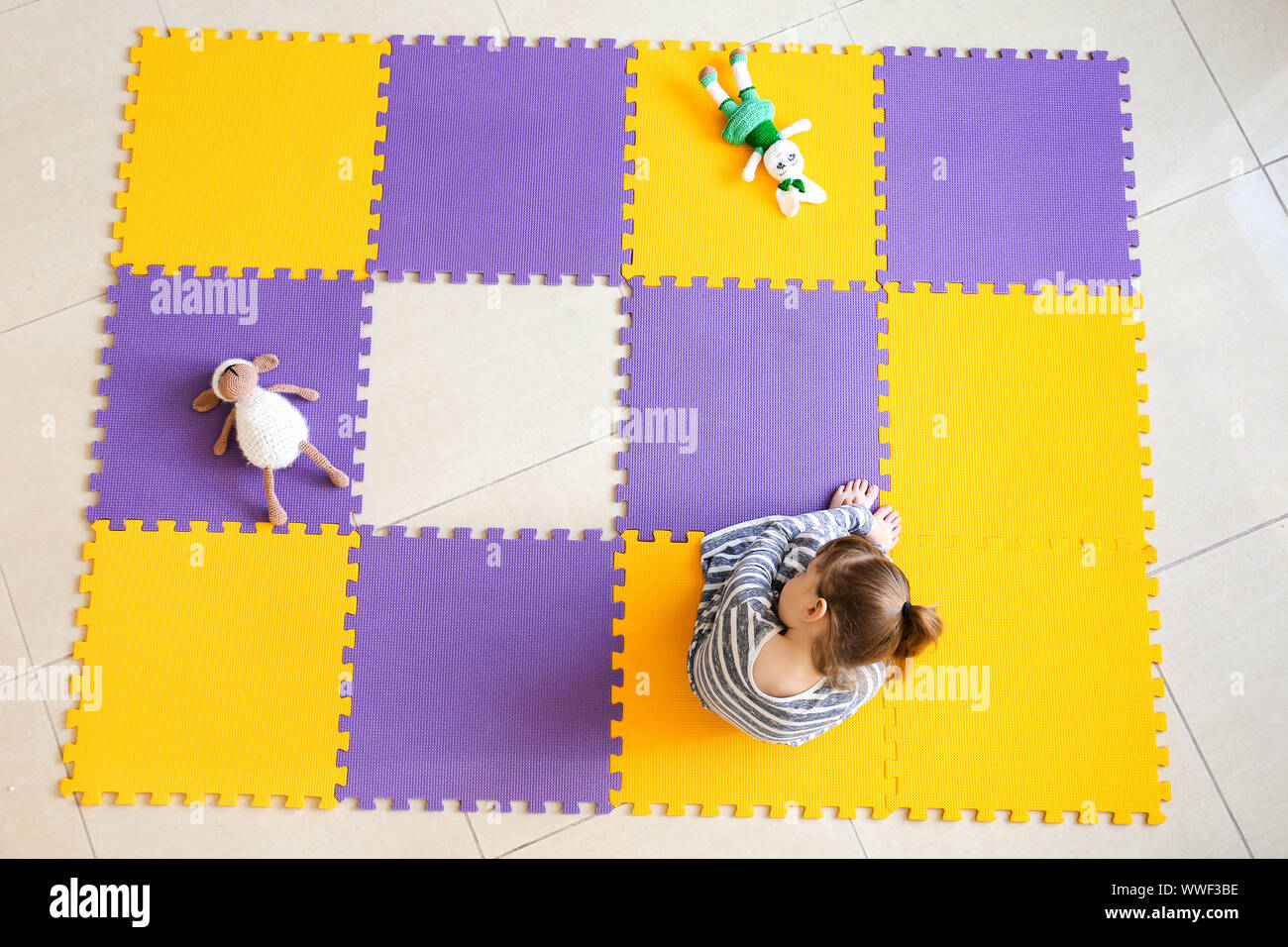 Little girl with autistic disorder sitting on floor, top view Stock ...