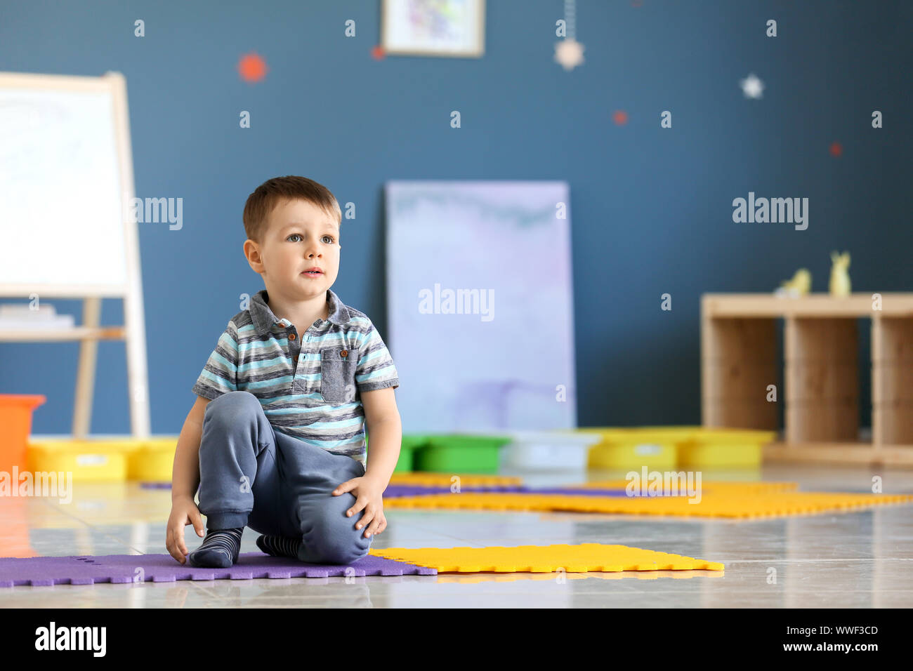 Little boy with autistic disorder in playroom Stock Photo - Alamy