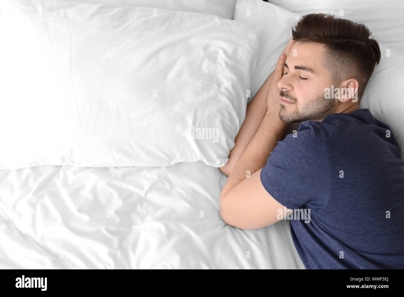 Handsome man sleeping in bed at home Stock Photo - Alamy