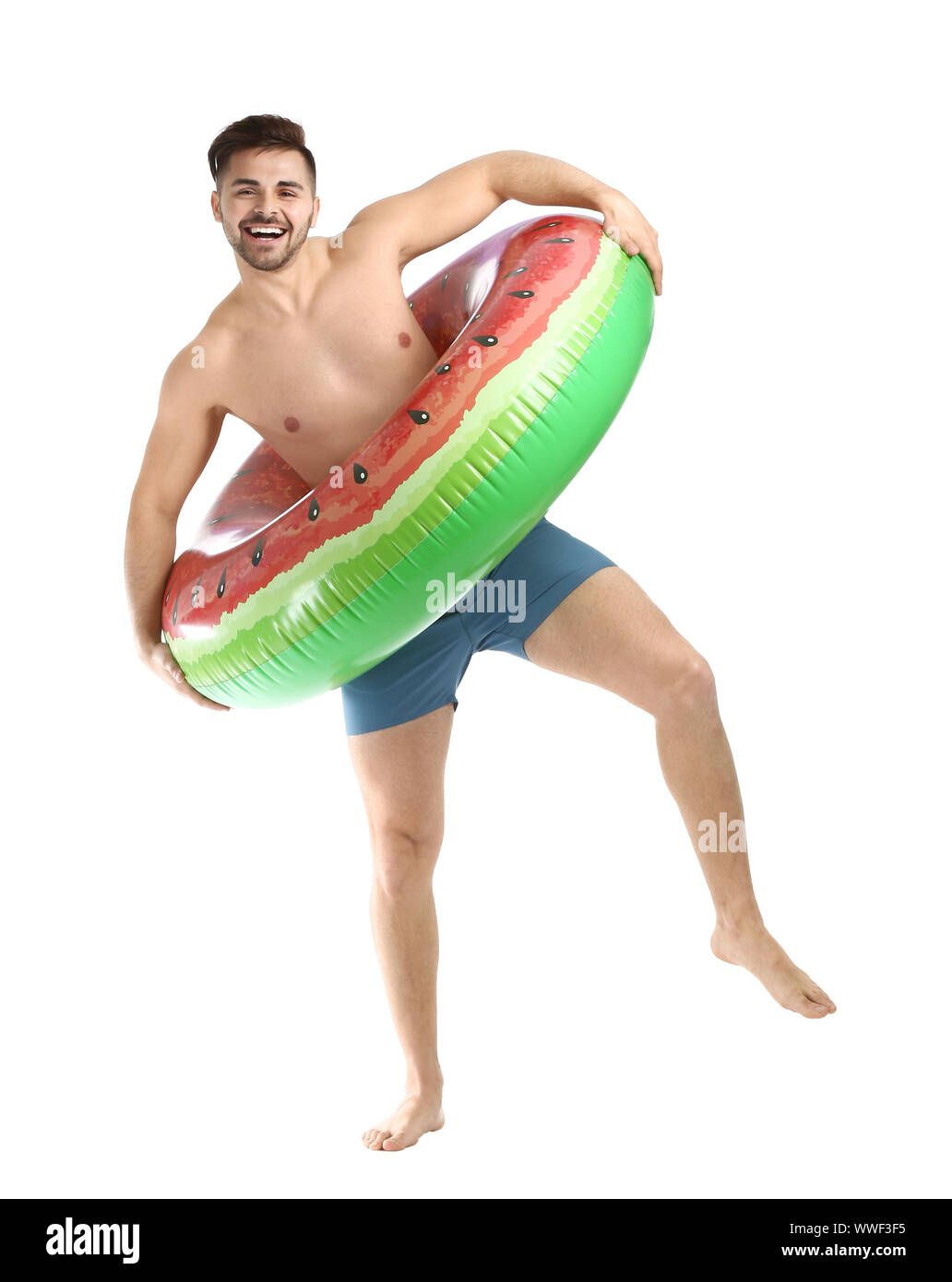 Happy young man with inflatable ring on white background Stock Photo ...