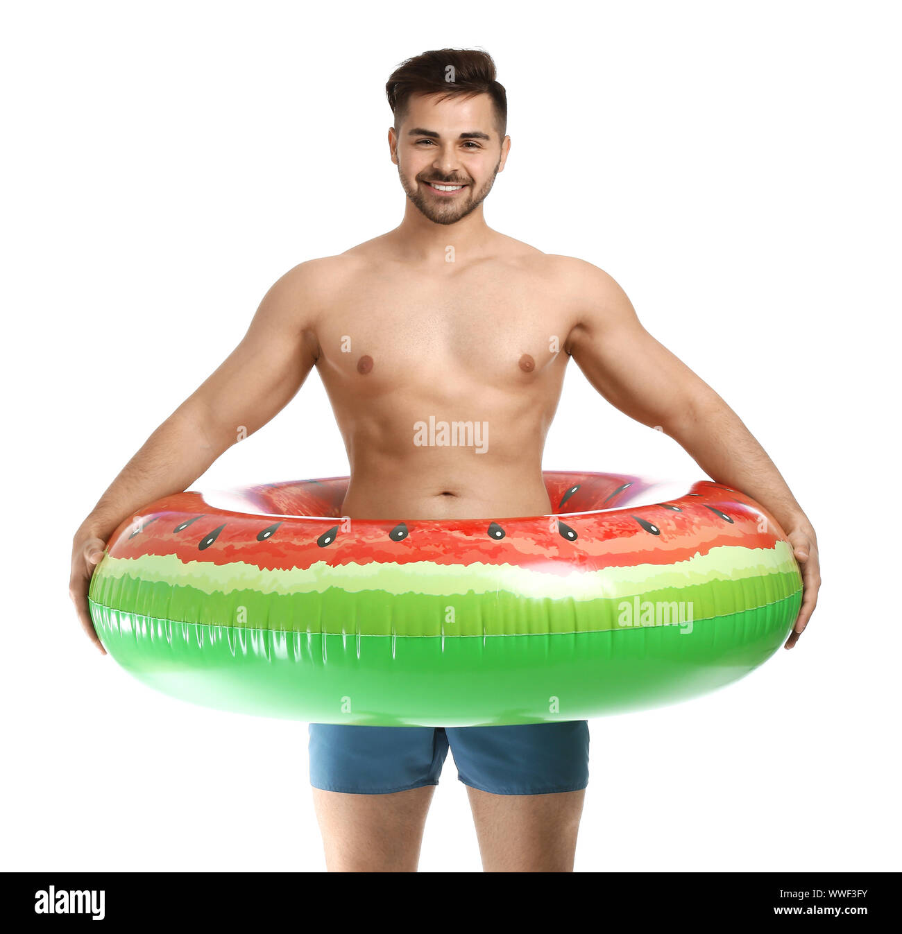 Happy young man with inflatable ring on white background Stock Photo ...