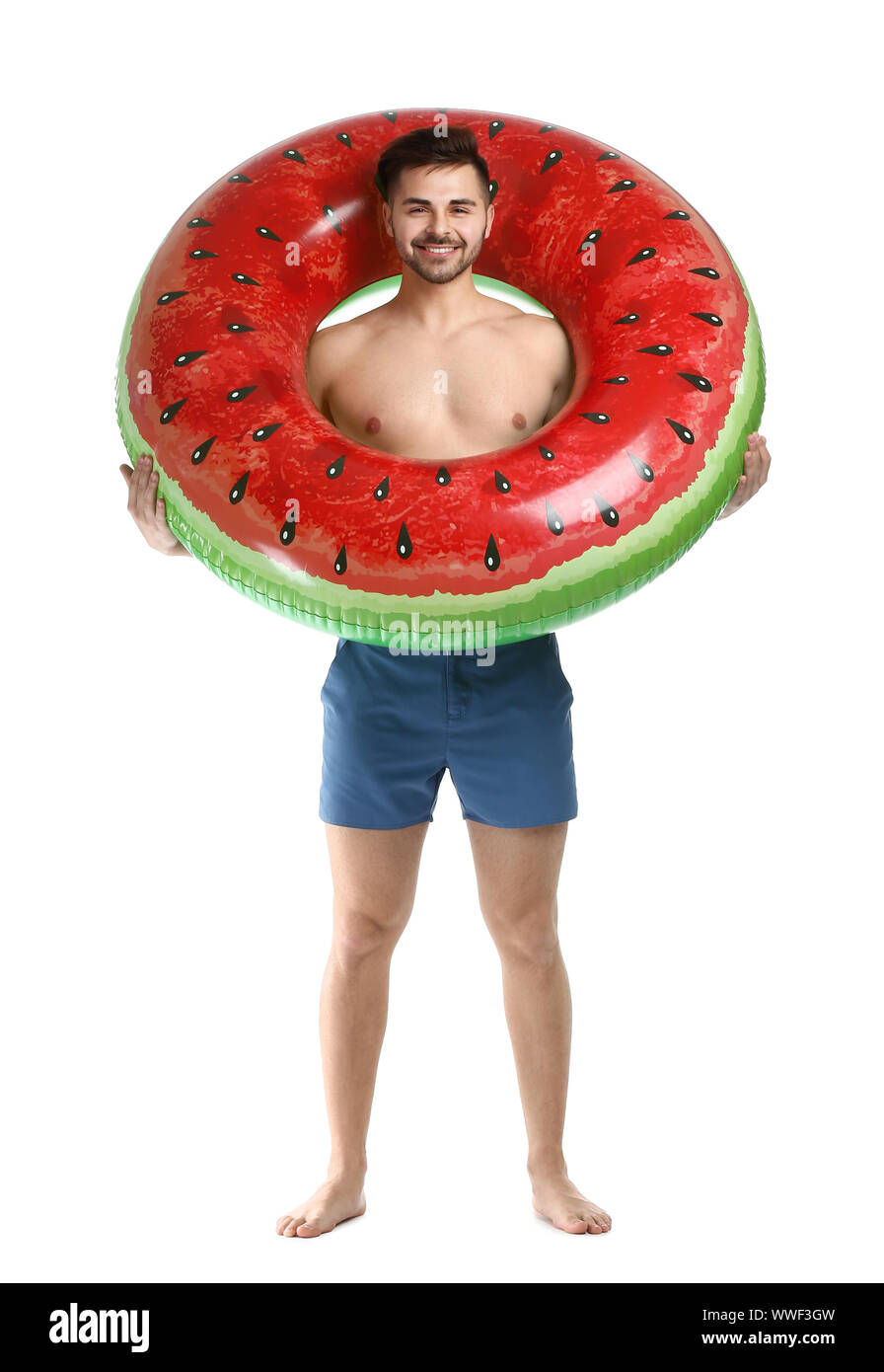 Happy young man with inflatable ring on white background Stock Photo ...