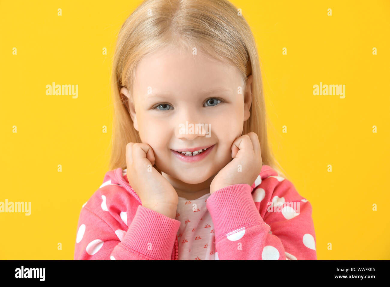 Portrait of adorable little girl on color background Stock Photo - Alamy