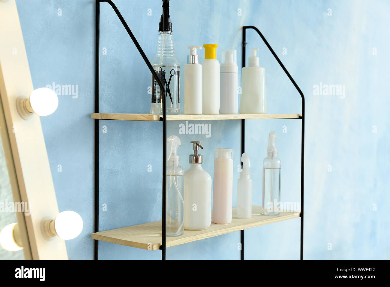 Stand with cosmetics in hairdressing salon Stock Photo - Alamy