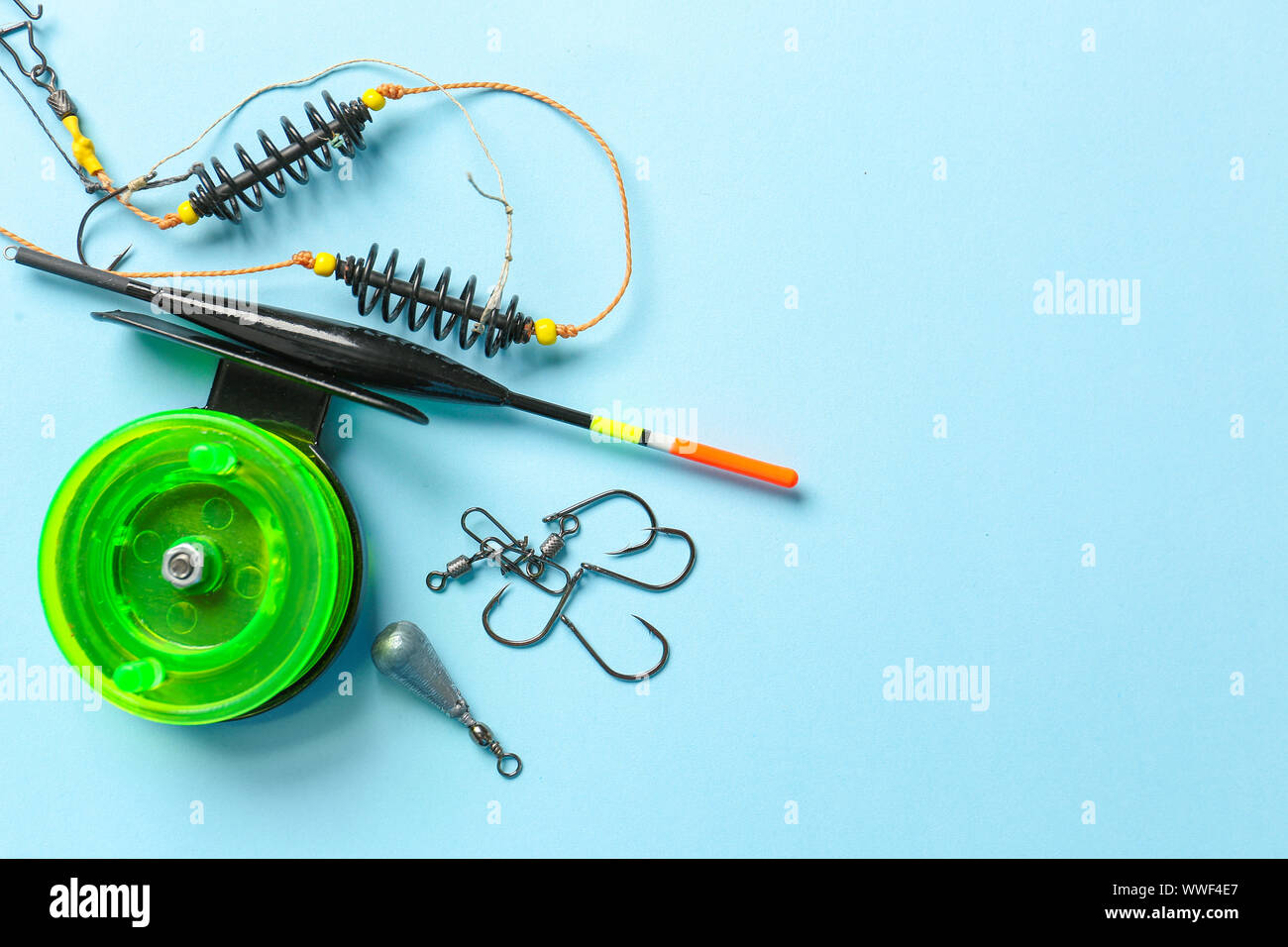 Different fishing equipment on color background Stock Photo - Alamy