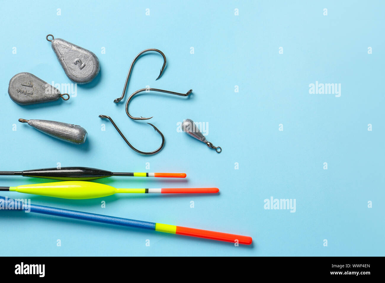 Different fishing equipment on color background Stock Photo - Alamy
