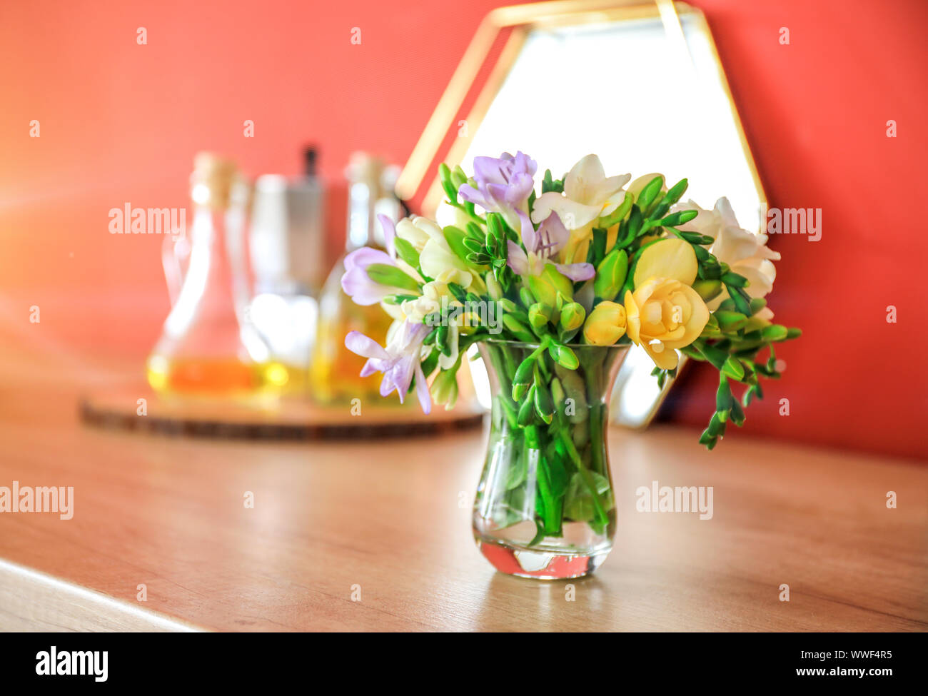 Fresh flowers on counter in kitchen Stock Photo - Alamy
