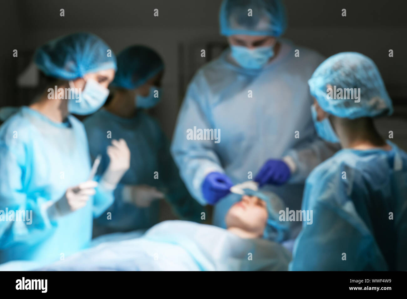 Blurred view of operation in plastic surgery clinic Stock Photo - Alamy