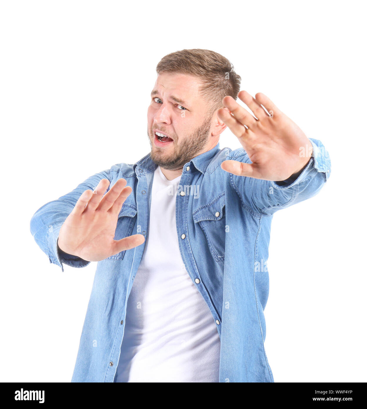 Handsome young man rejecting something on white background Stock Photo ...
