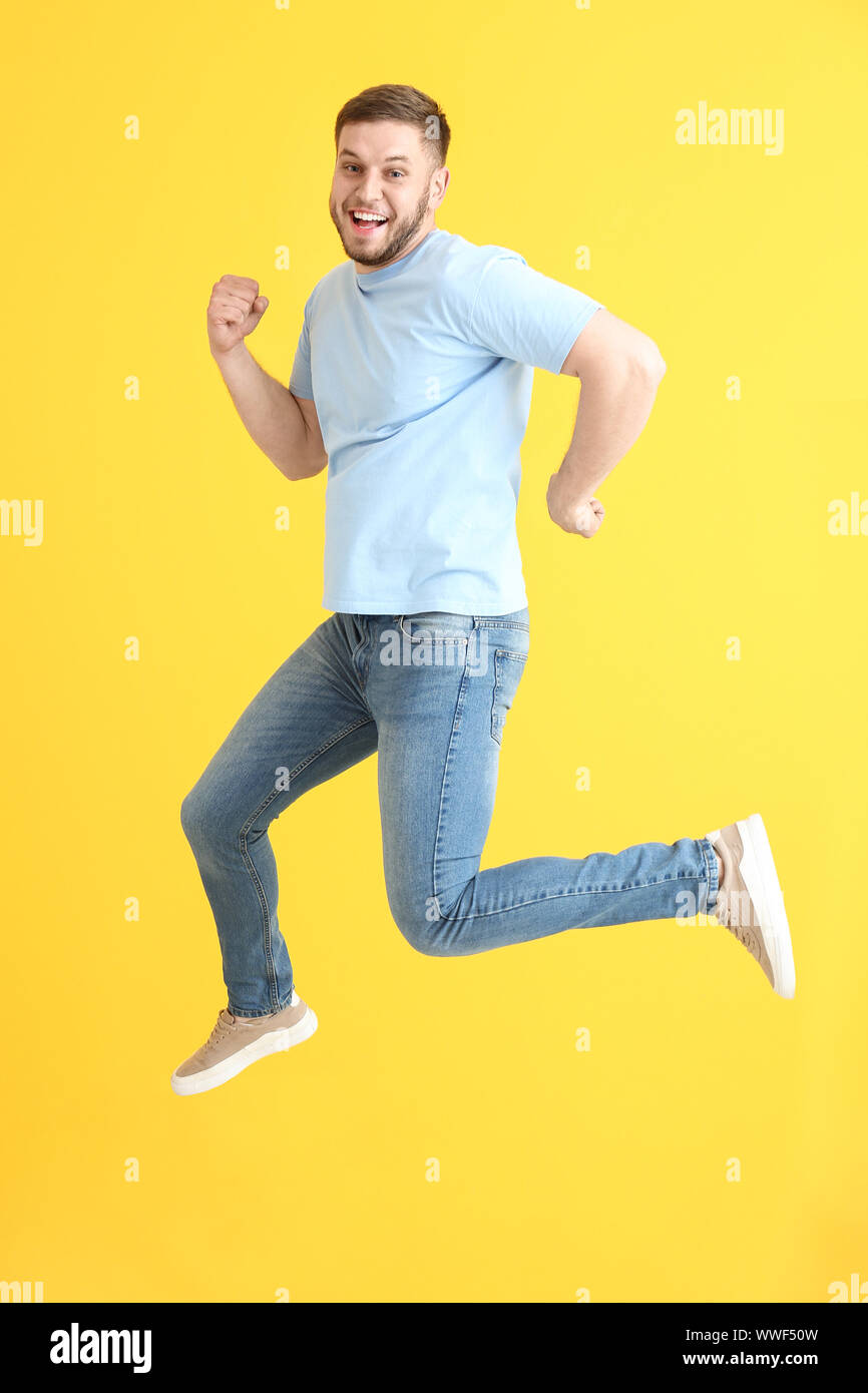 Handsome jumping young man hi-res stock photography and images - Alamy