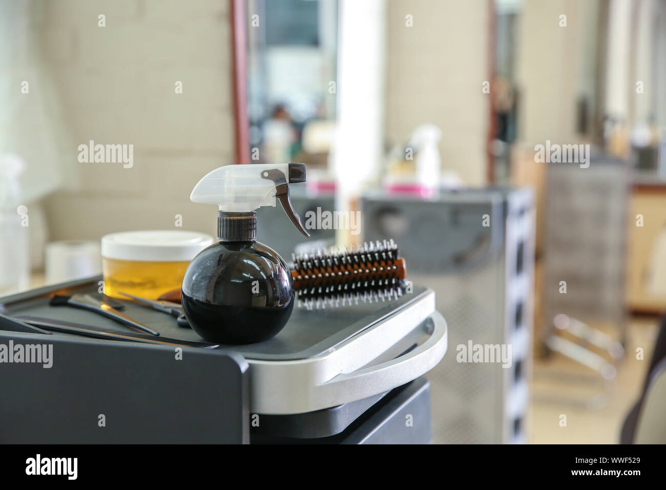 Tools and cosmetics on organizer in hairdressing salon Stock Photo - Alamy