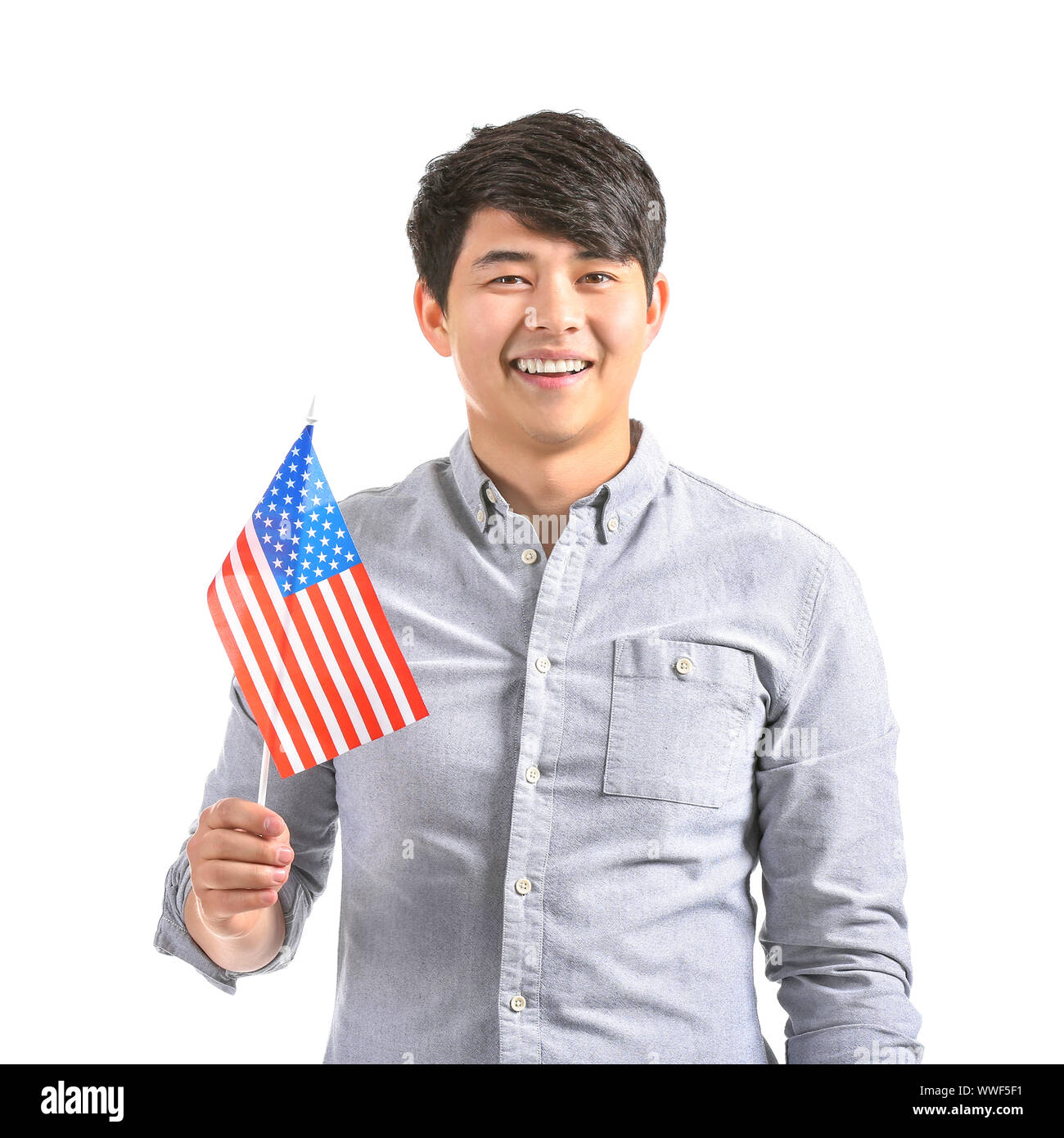 Young Asian man with USA flag on white background Stock Photo - Alamy