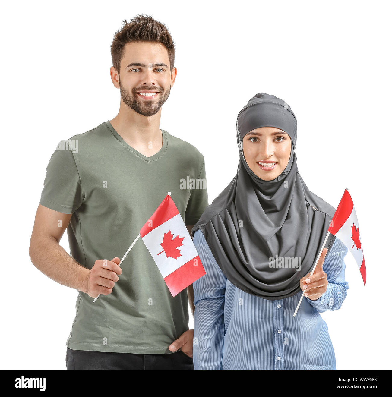 Young people with Canadian flags on white background Stock Photo - Alamy