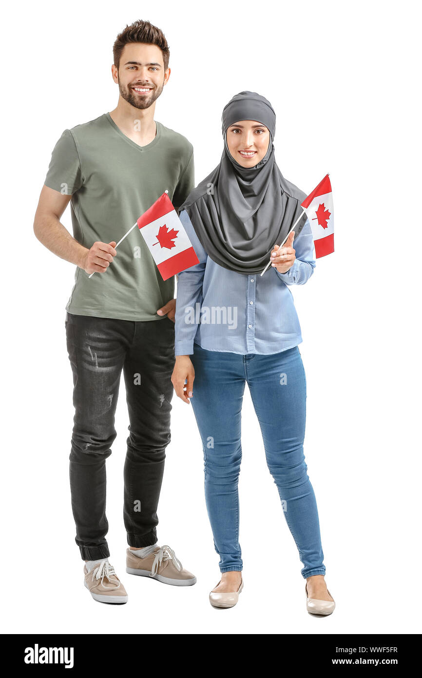 Young people with Canadian flags on white background Stock Photo - Alamy