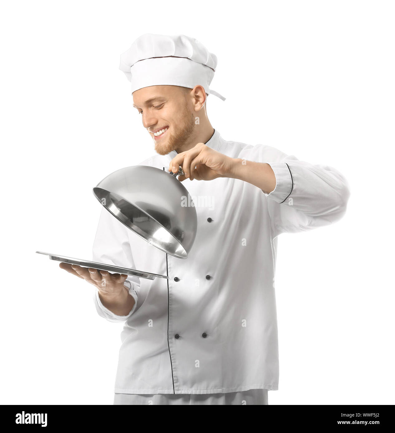 Handsome male chef with tray and cloche on white background Stock Photo ...