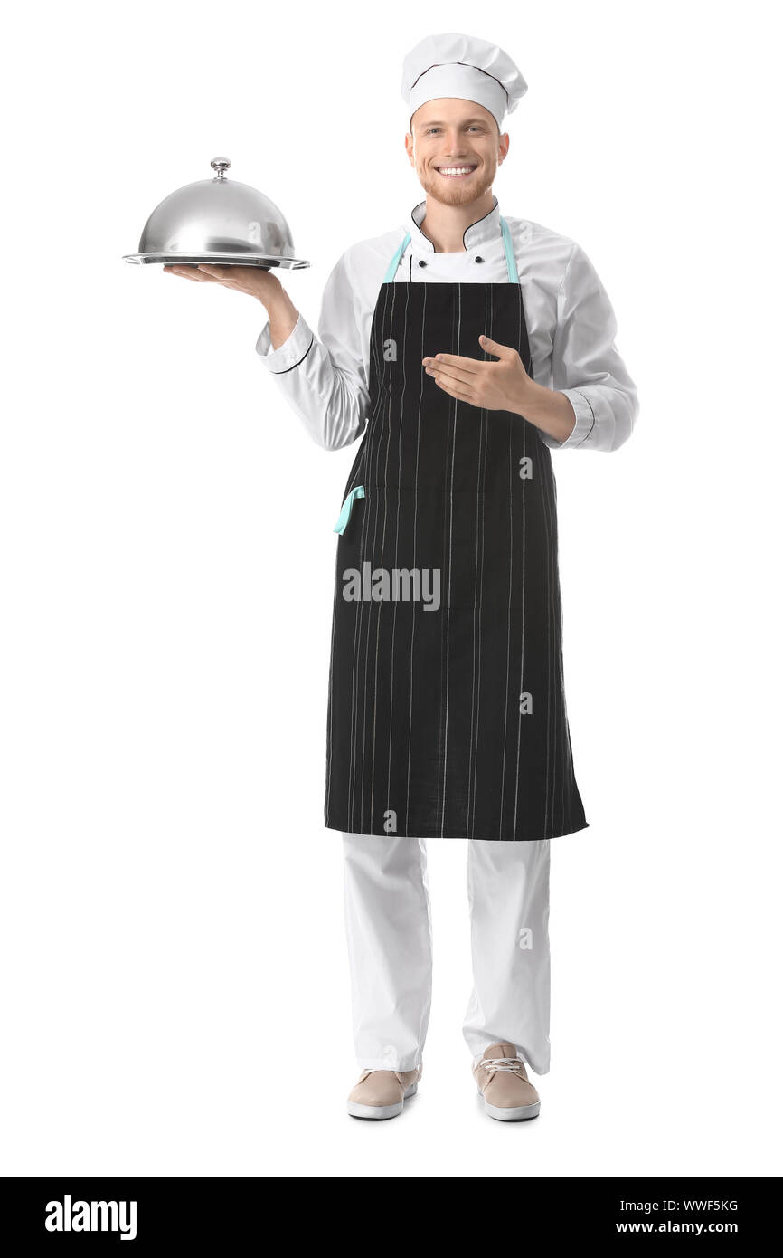 Handsome male chef with tray and cloche on white background Stock Photo ...