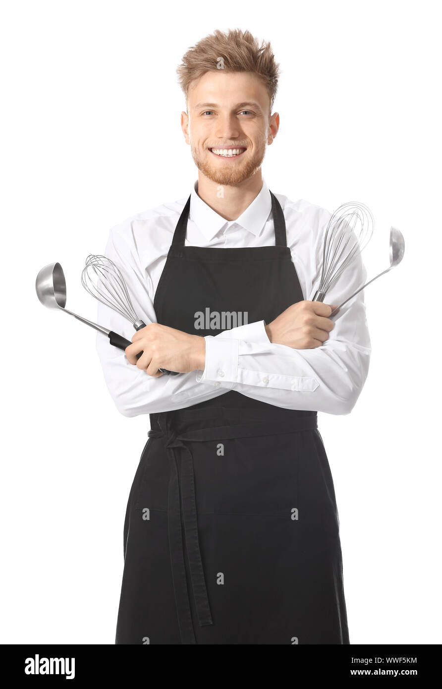 Handsome male chef with kitchenware on white background Stock Photo - Alamy