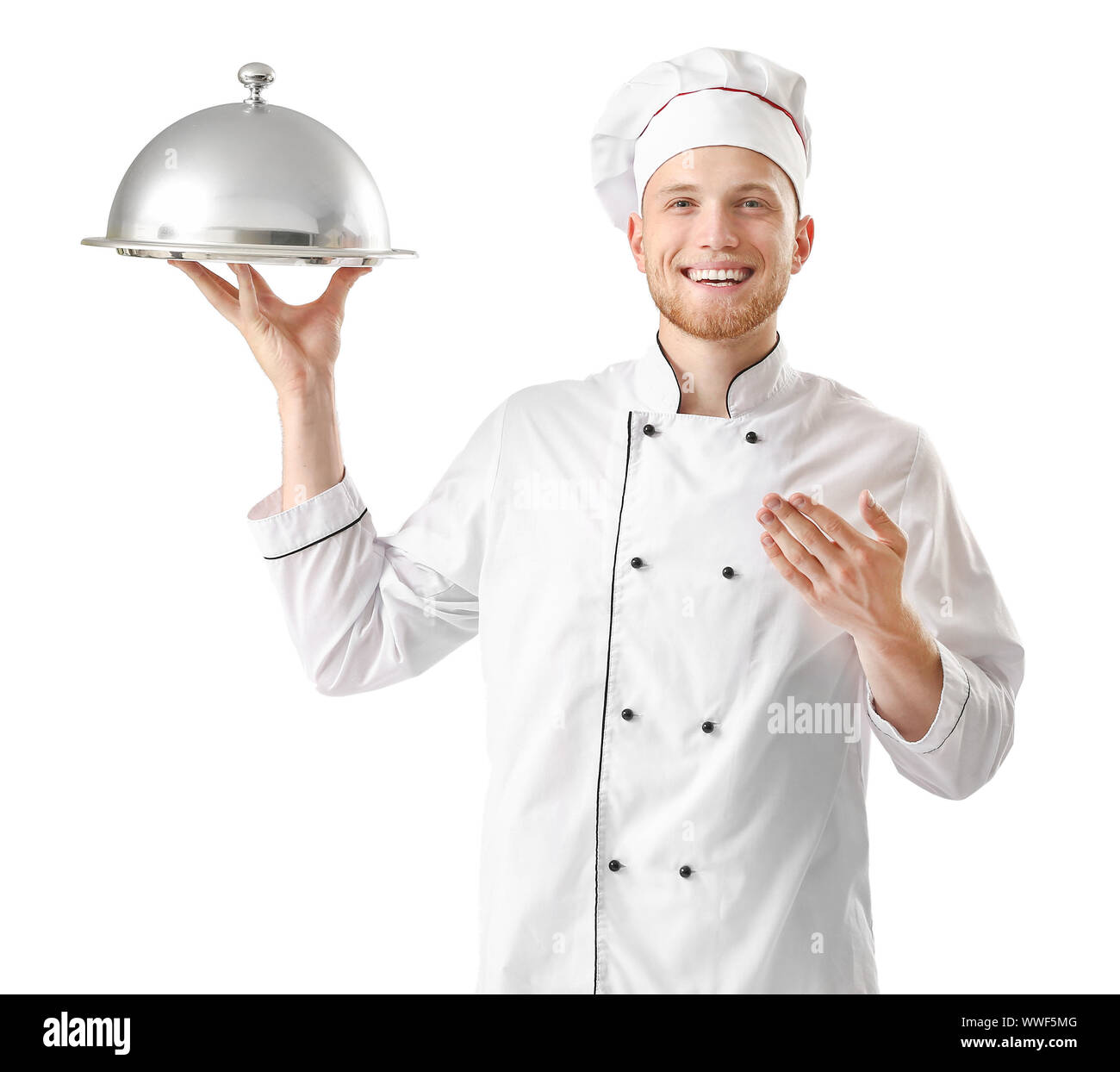 Handsome male chef with tray and cloche on white background Stock Photo ...