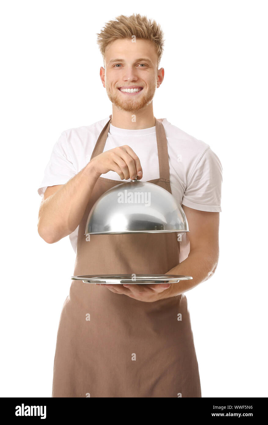 Handsome male chef with tray and cloche on white background Stock Photo ...