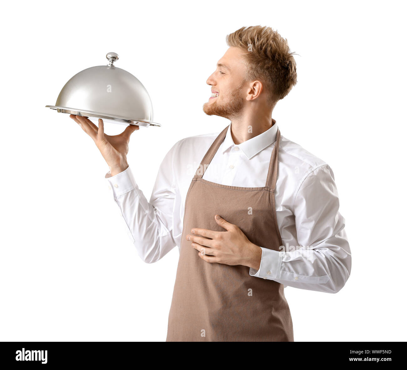 Handsome male chef with tray and cloche on white background Stock Photo ...