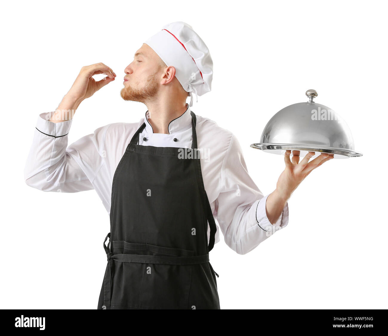 Handsome male chef with tray and cloche on white background Stock Photo ...