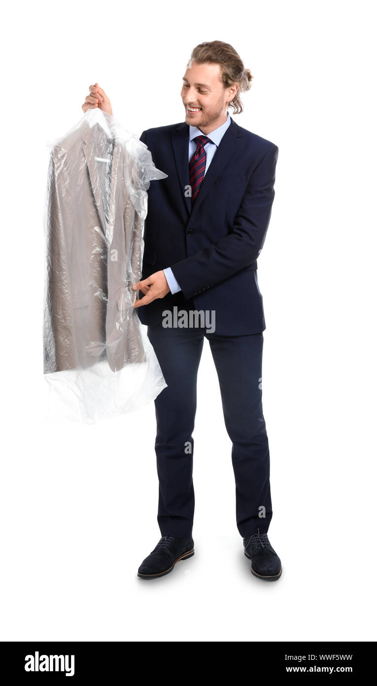 Businessman with clothes after dry-cleaning on white background Stock ...