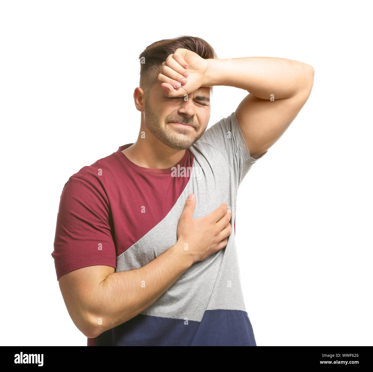Young man suffering from heart attack on white background Stock Photo ...