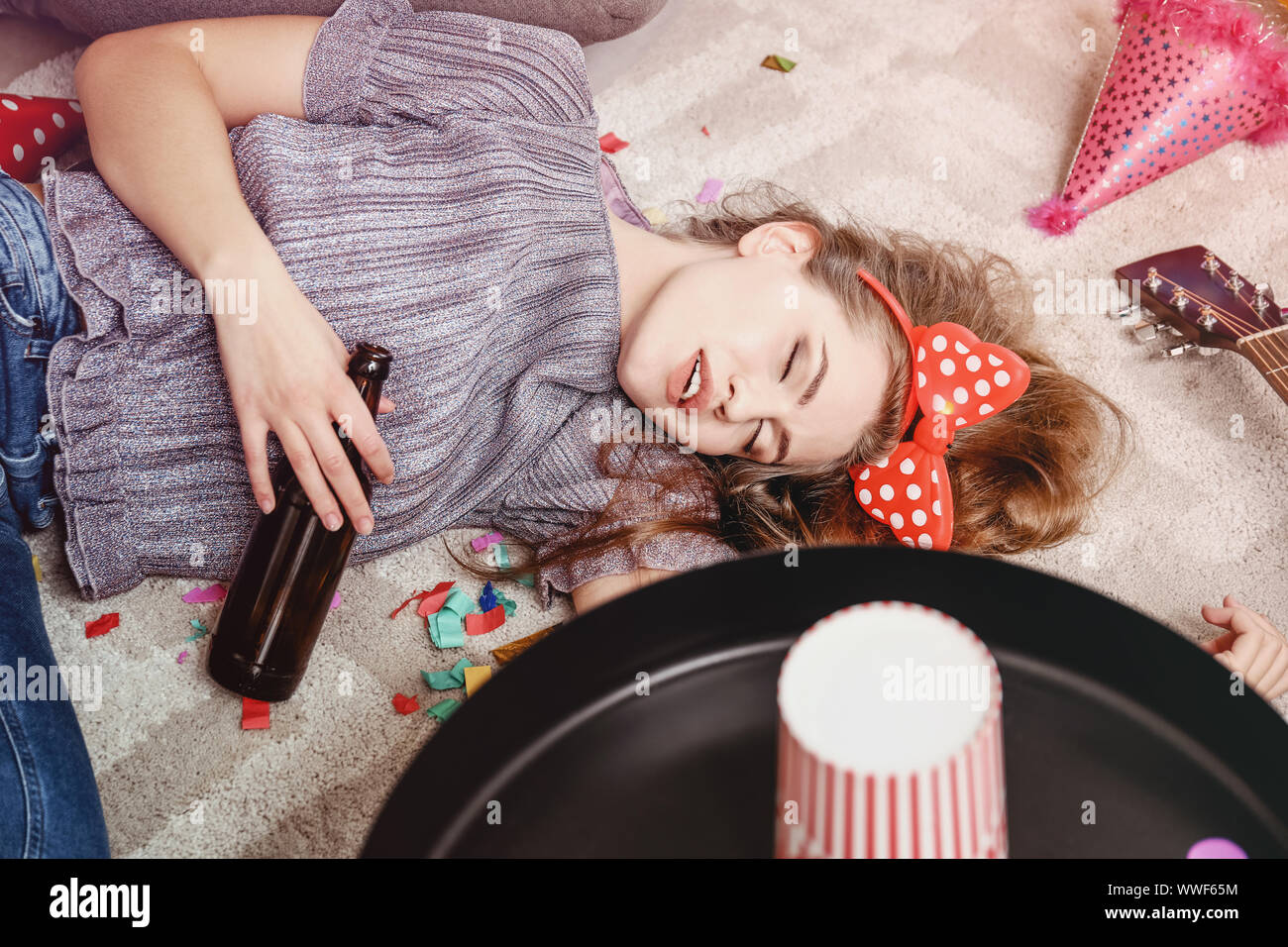 Young woman sleeping after party at home Stock Photo - Alamy