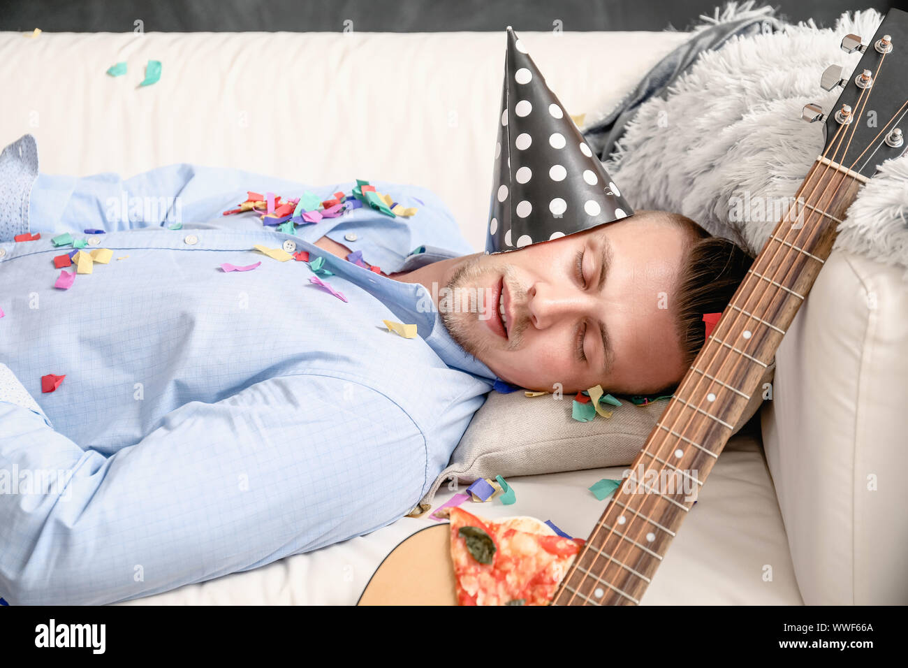 Young man sleeping after party at home Stock Photo - Alamy