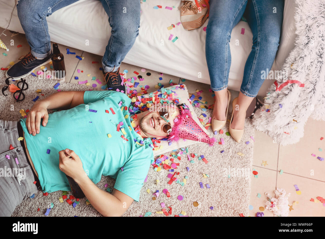 Young man sleeping after party at home Stock Photo - Alamy