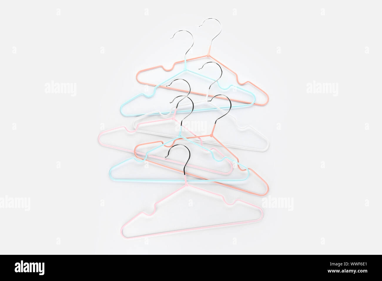Clothes hangers on white background Stock Photo - Alamy