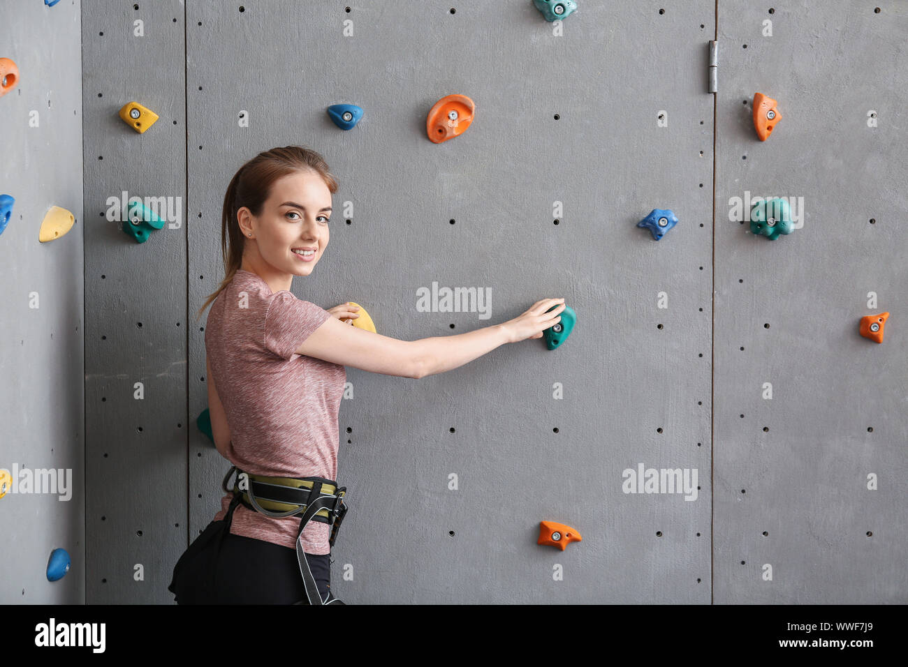 Sporty young woman in climbing gym Stock Photo - Alamy