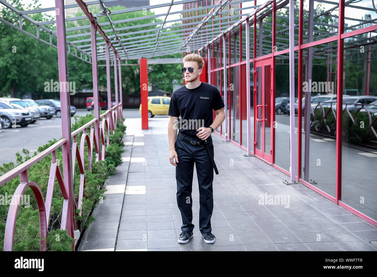 Handsome male security guard outdoors Stock Photo - Alamy