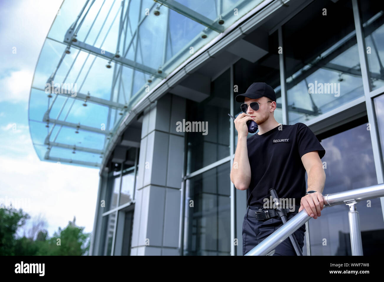 Handsome male security guard outdoors Stock Photo - Alamy