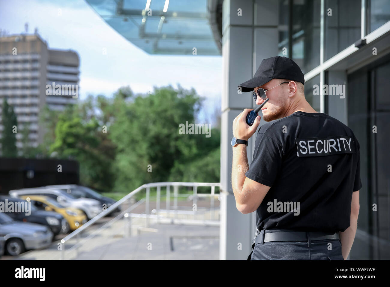 Handsome male security guard outdoors Stock Photo - Alamy
