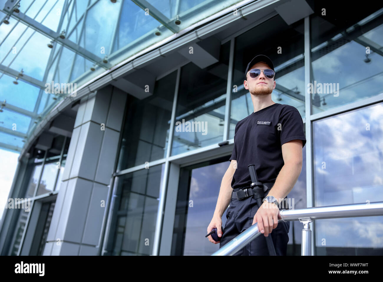 Handsome male security guard outdoors Stock Photo - Alamy