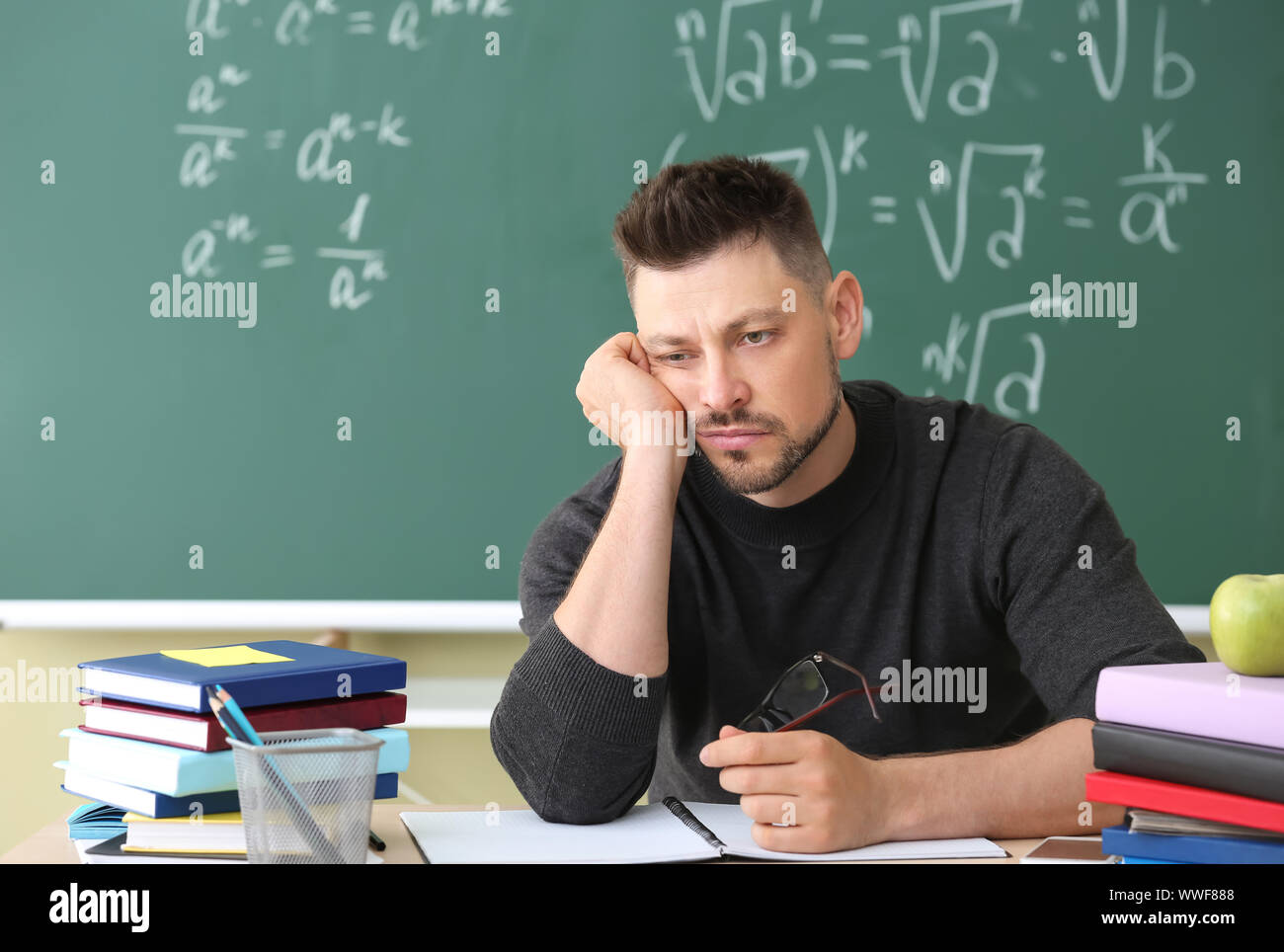 Exhausted teacher in classroom hi-res stock photography and images - Alamy