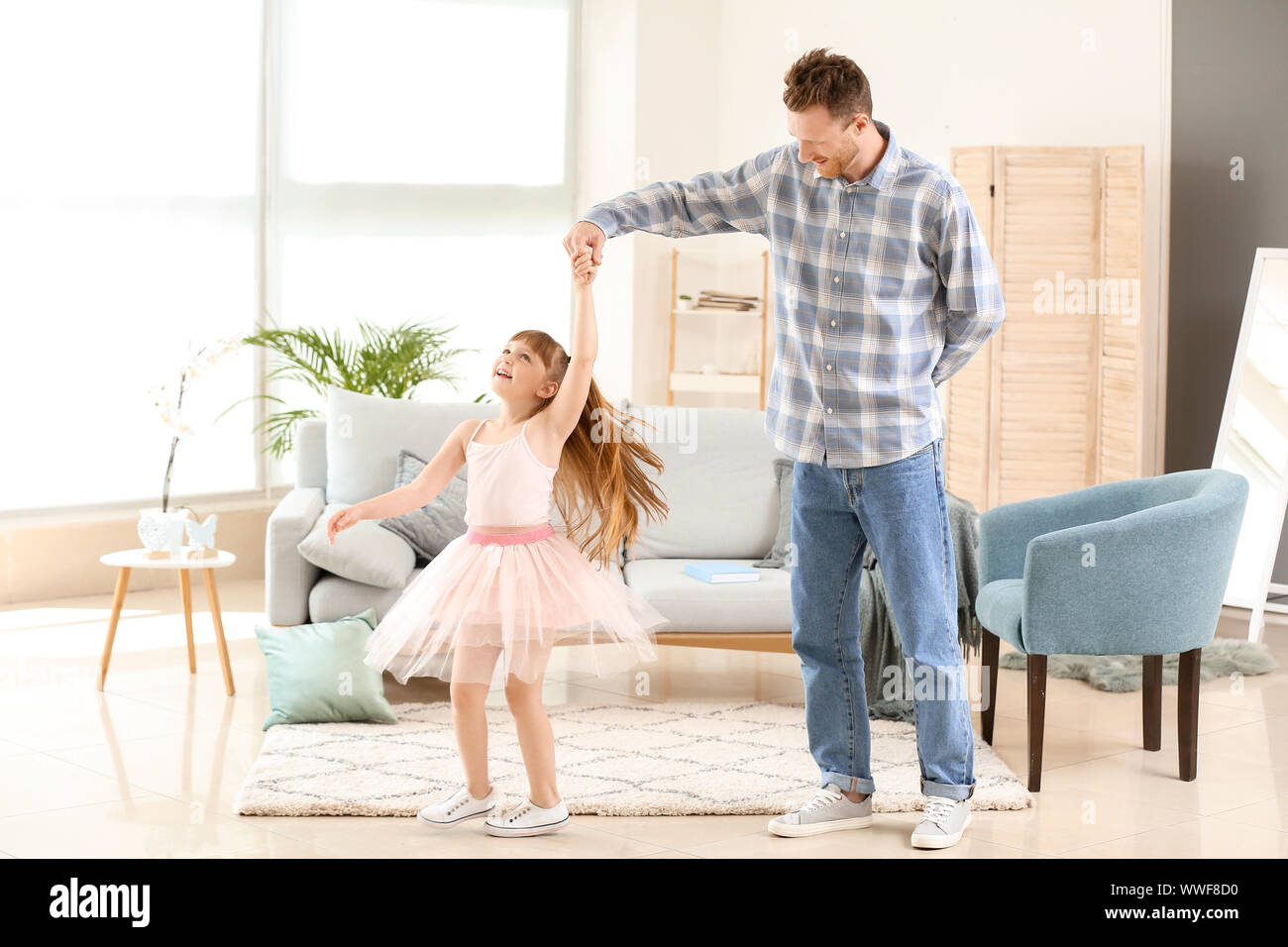 Happy father and his little daughter dancing at home Stock Photo - Alamy