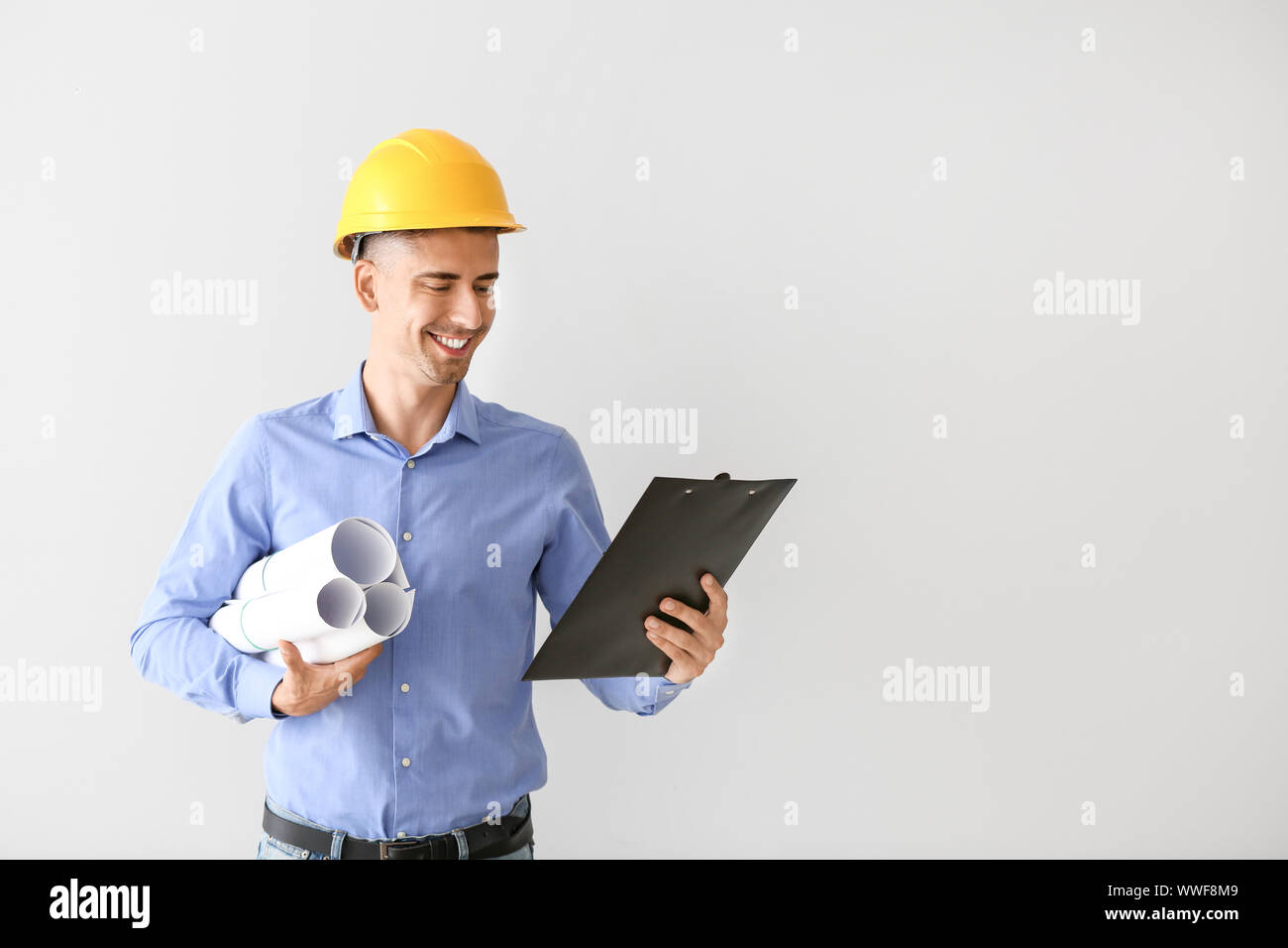 Handsome male architect on white background Stock Photo - Alamy
