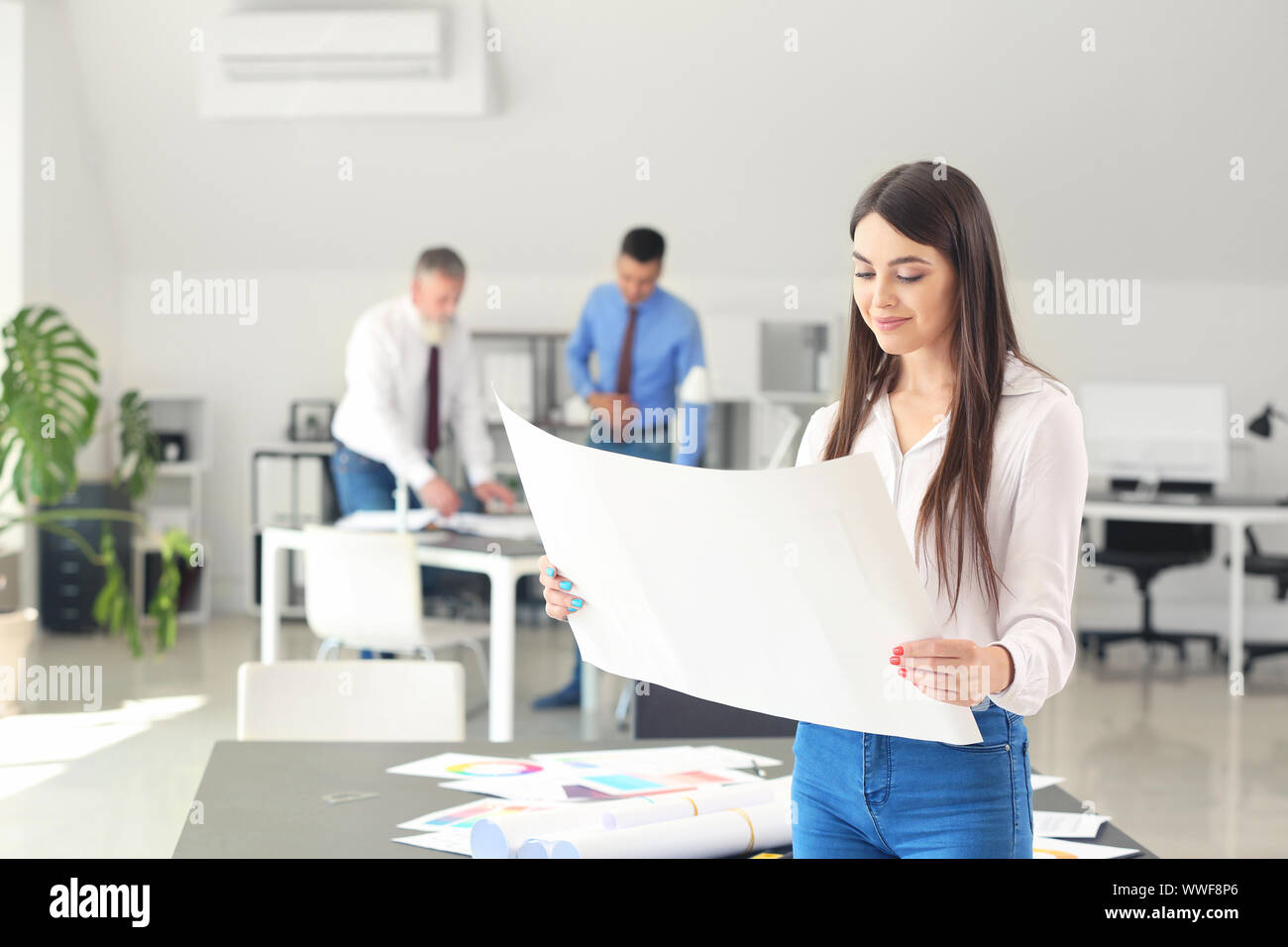 Beautiful female architect in office Stock Photo - Alamy